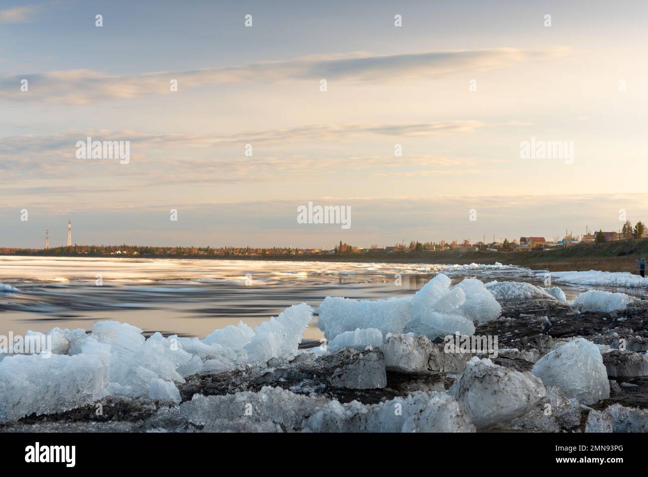 Ice movement on the spring river Vilyui in Yakutia at sunset against ...