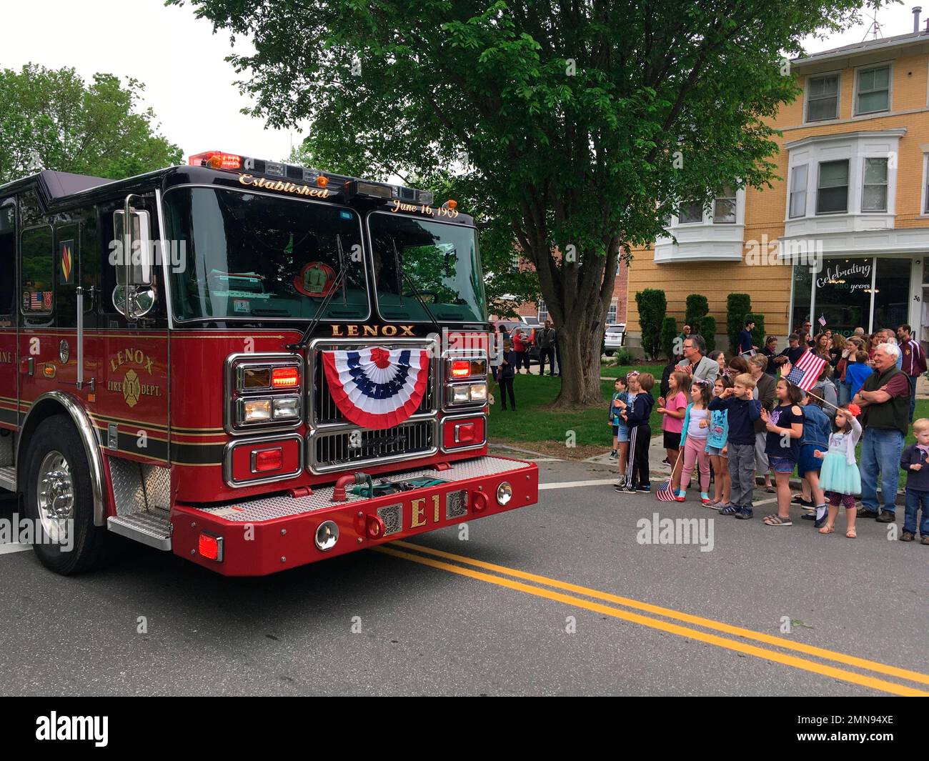 A Memorial Day parade makes its way up Main Street in Lenox, Mass ...