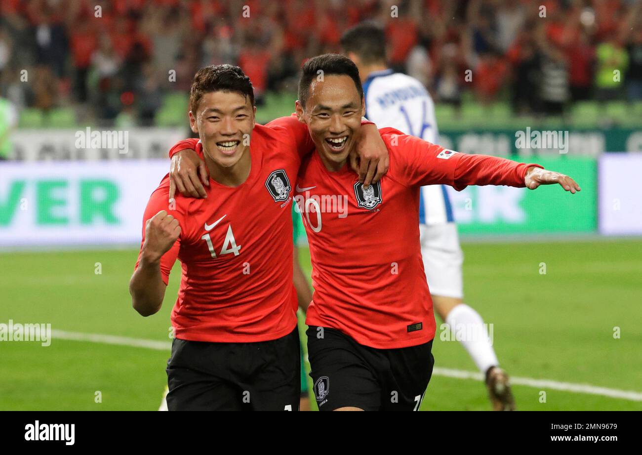 South Korea's Moon Seon-min, right, celebrates with his teammate Hwang ...