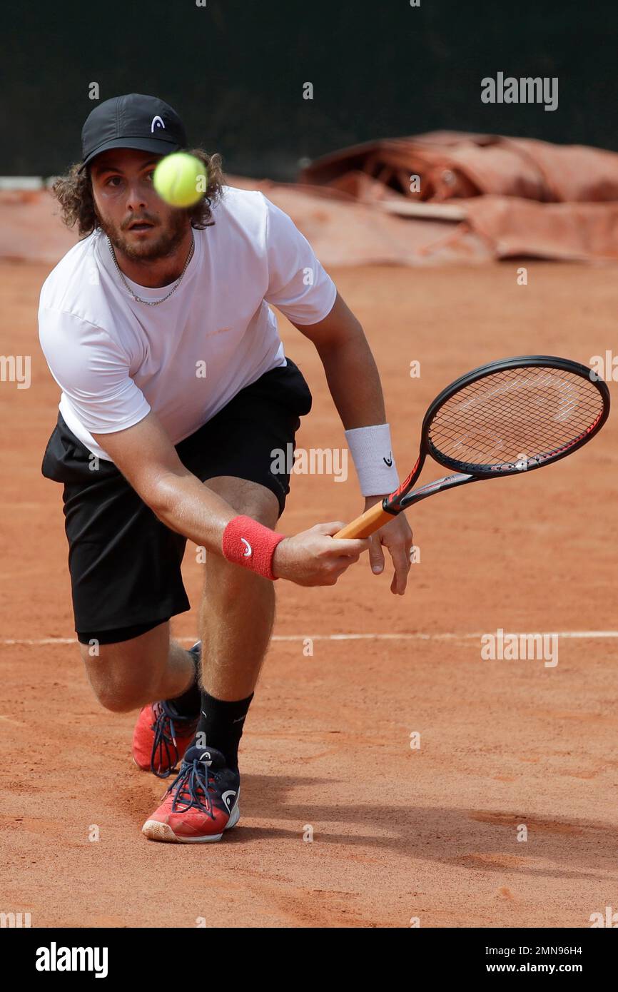 Argentina's Marco Trungelliti returns the ball to Australia's Bernard ...