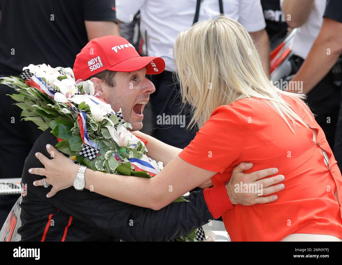 Will Power, of Australia, celebrates with his wife, Liz, after winning ...