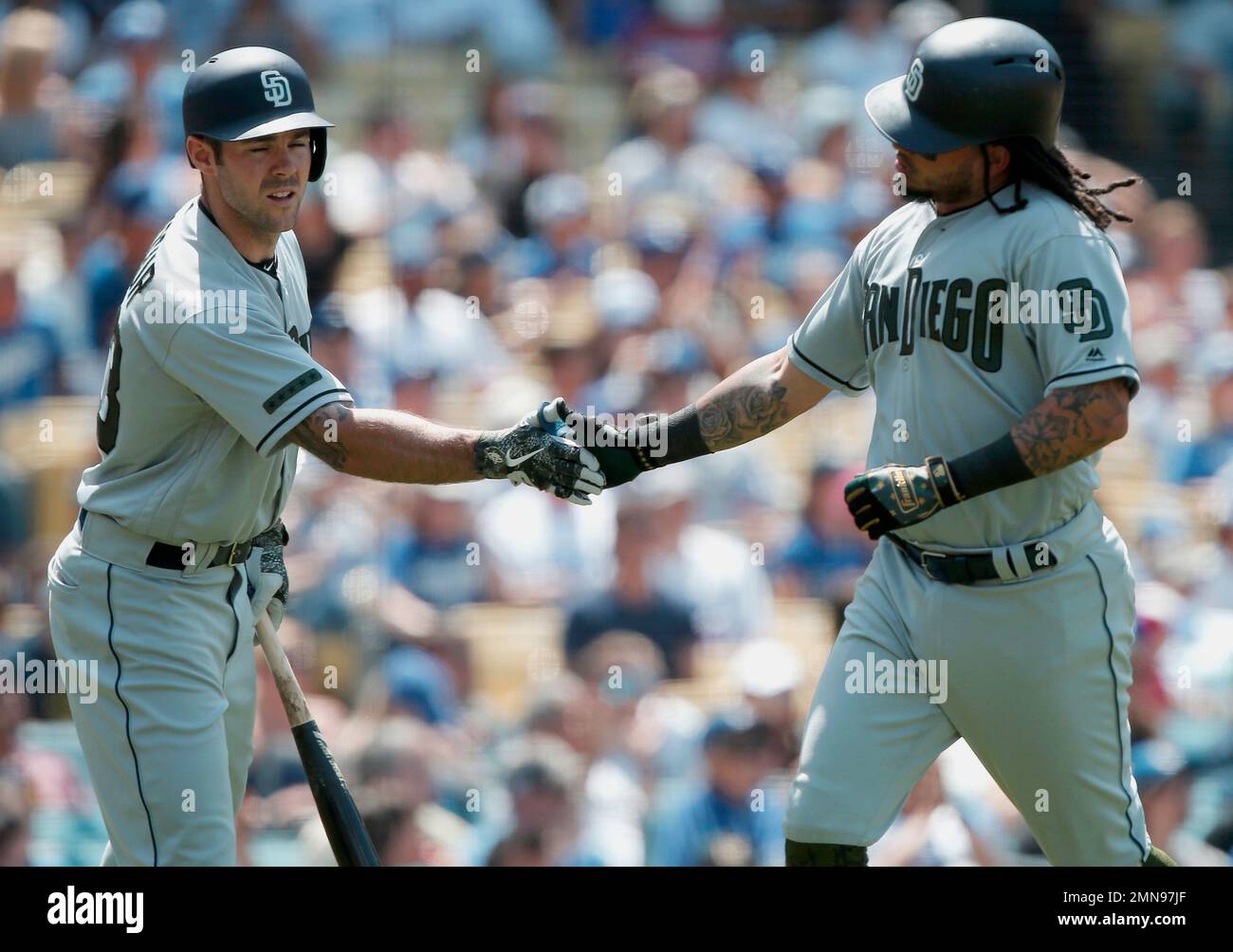 San Diego Padres' Freddy Galvis, right, gets congratulations from Matt ...