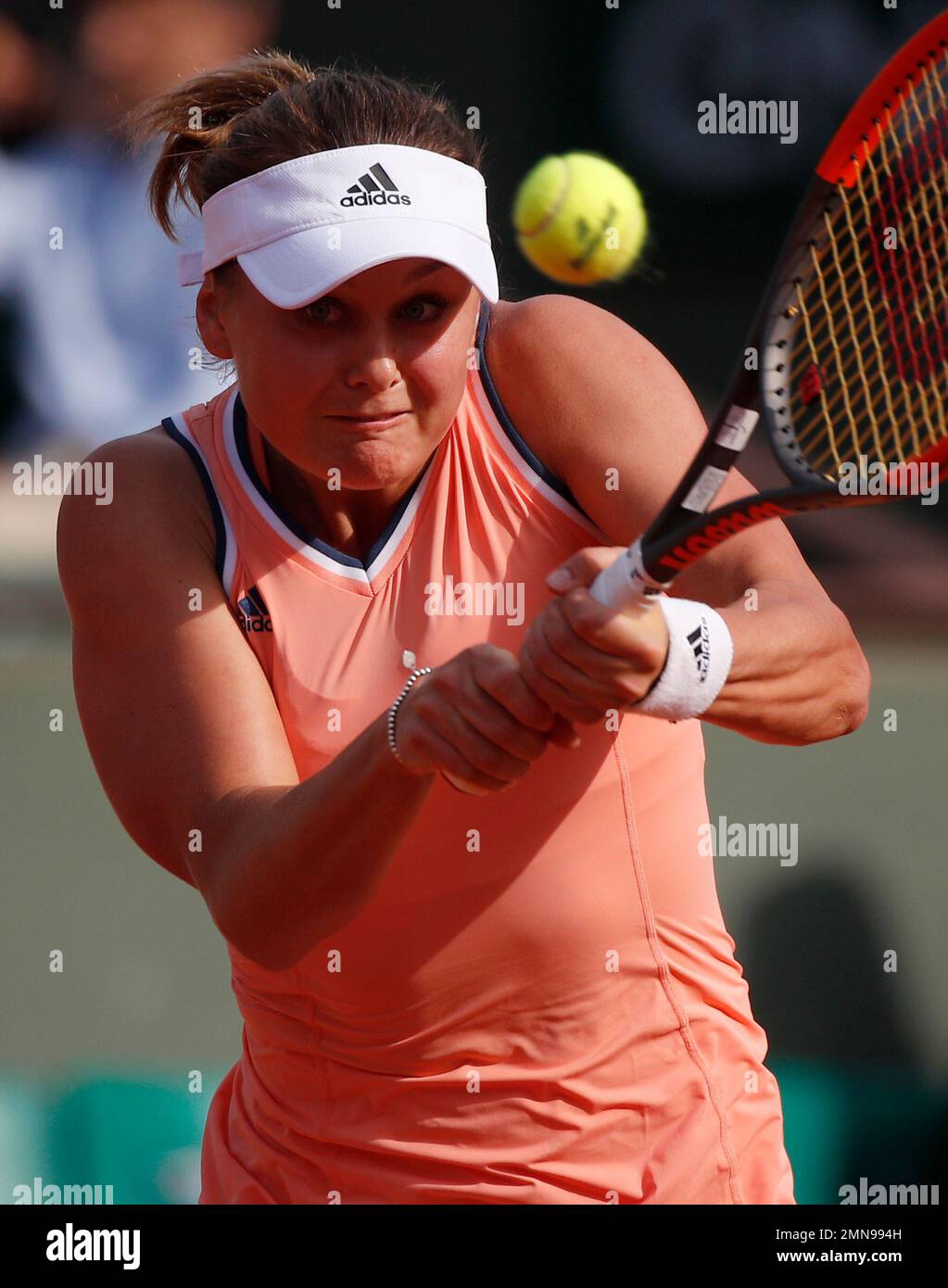 Ukraine's Kateryna Kozlova returns the ball to Latvia's Jelena ...