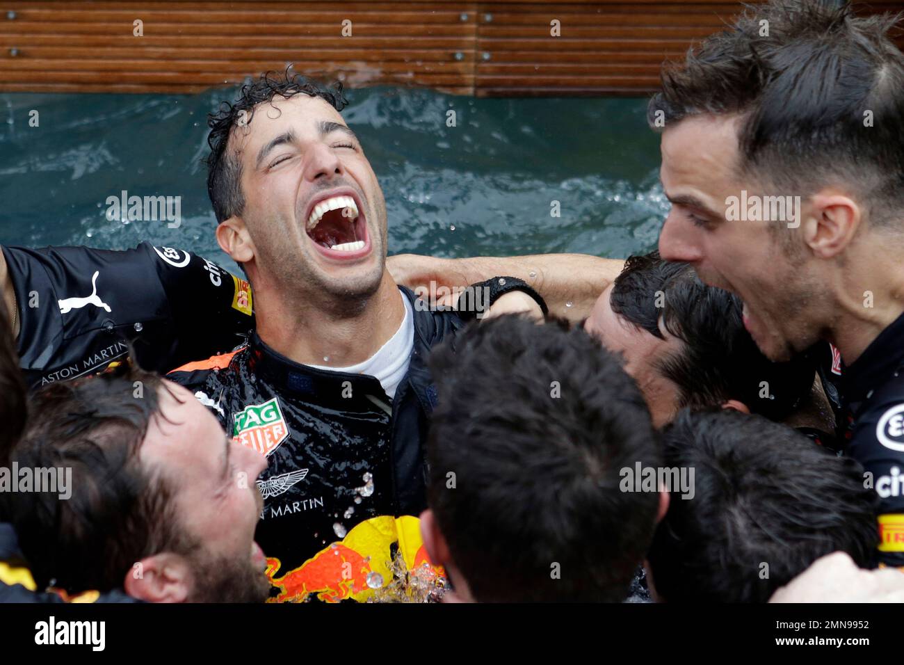 Red Bull driver Daniel Ricciardo of Australia, center, celebrates in a ...