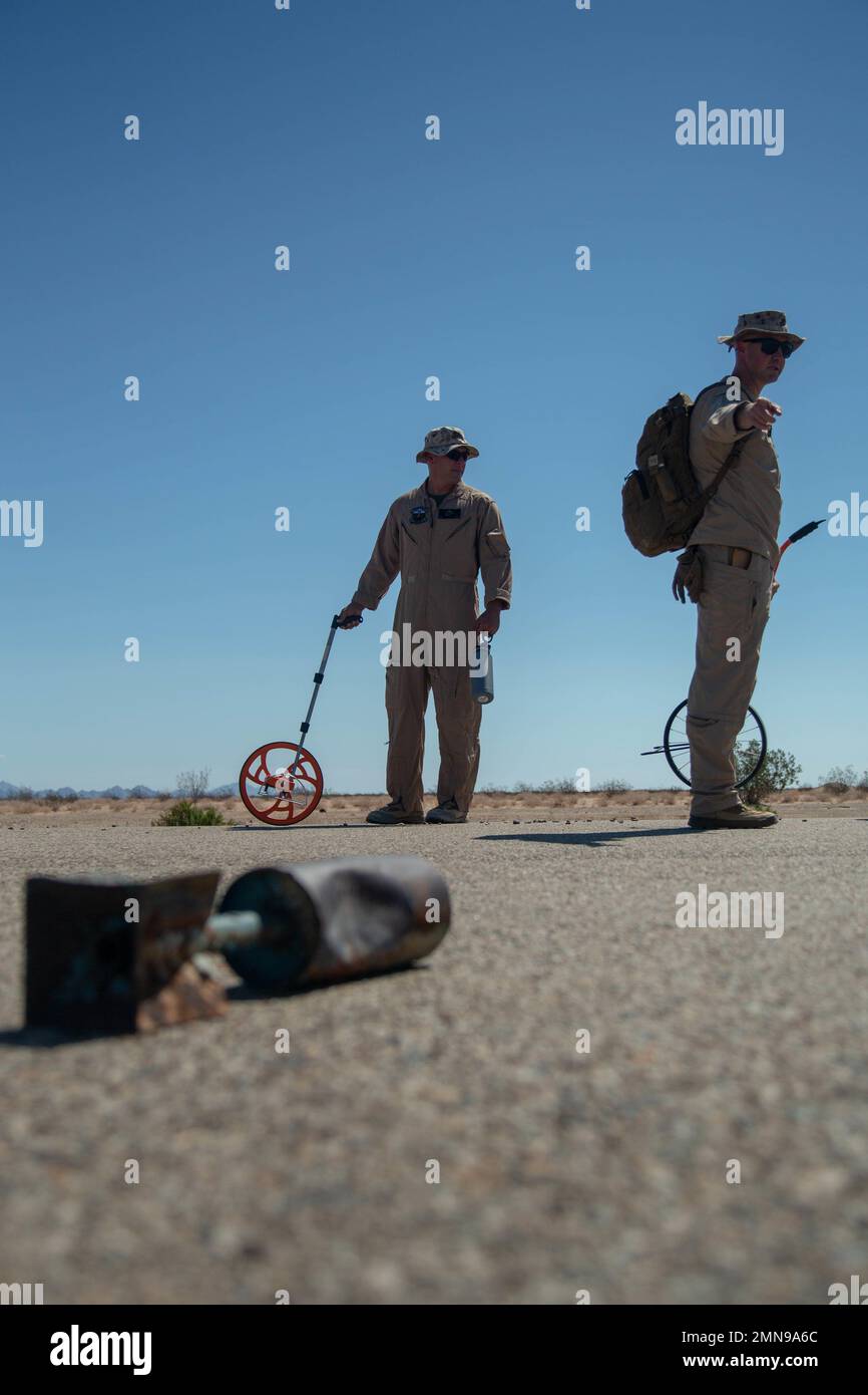 U.S. Marine Corps Capt. Steven M. Scher, left, logistics officer, from ...