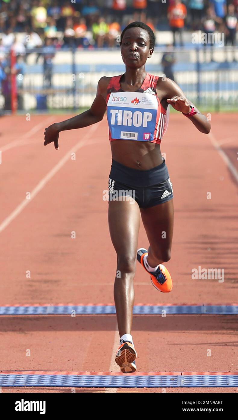 Kenyan athlete Agnes Tirop crosses the finish line to win the TCS World ...