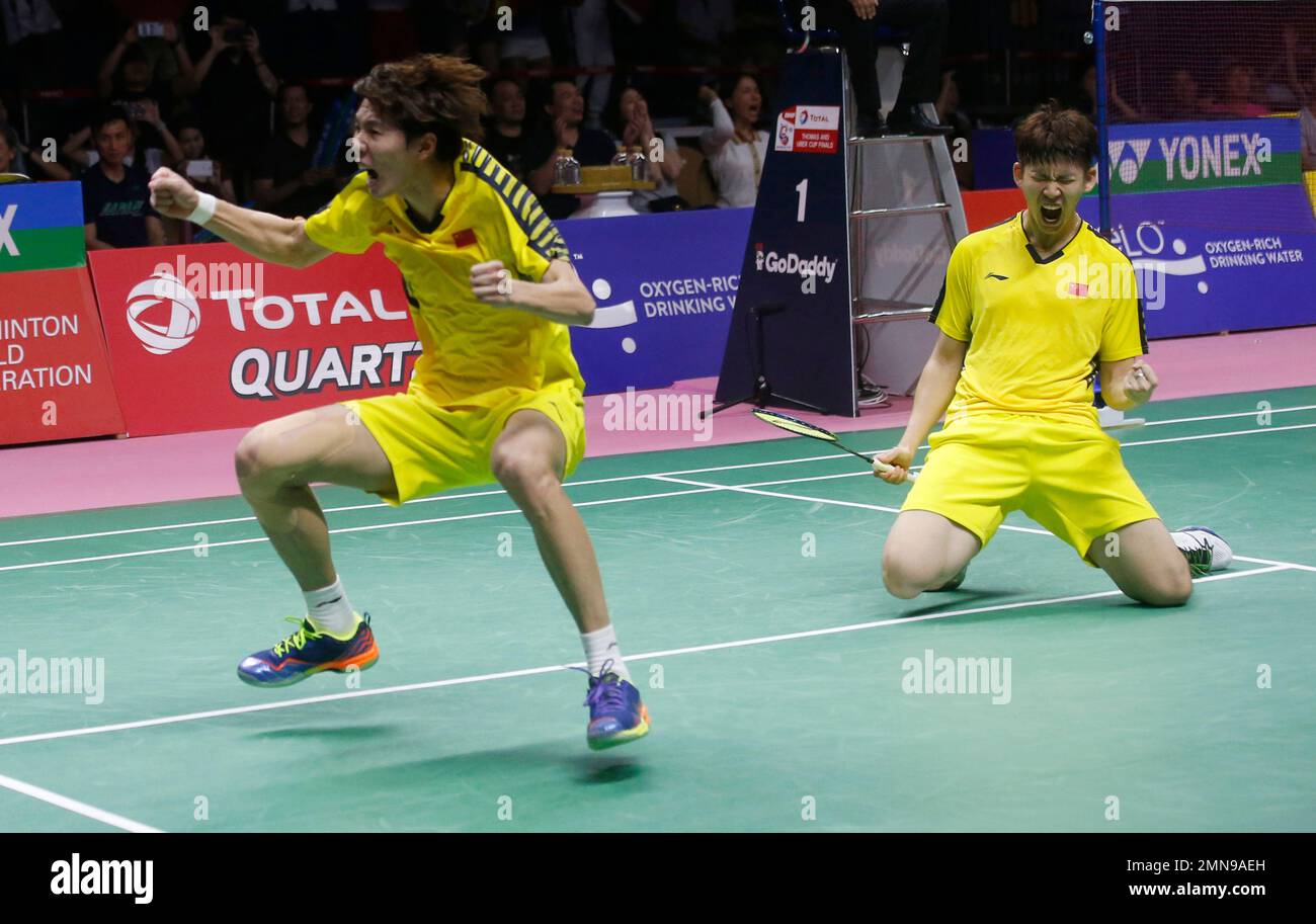 China's Li Junhui, left, and Liu Yuchen, right, react after winning ...