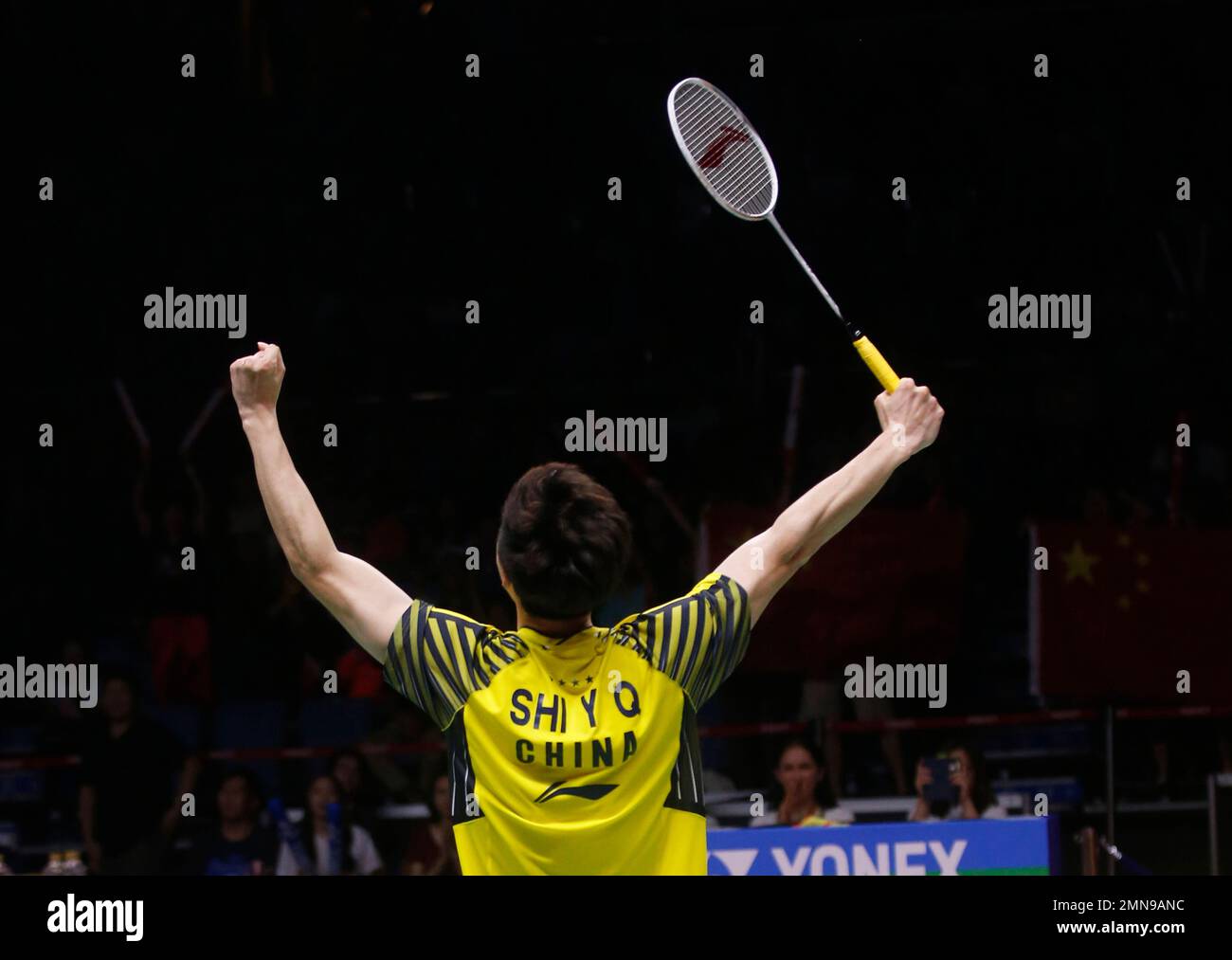 Shi Yuqi of China celebrates after winning to Kenta Nishimoto of Japan ...