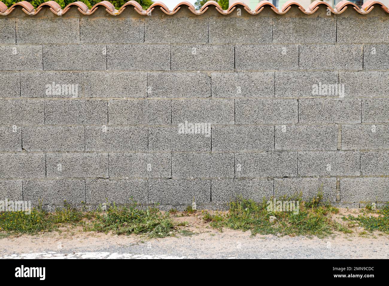 street brick gray cinder block cement wall with roof tiles and floor ...