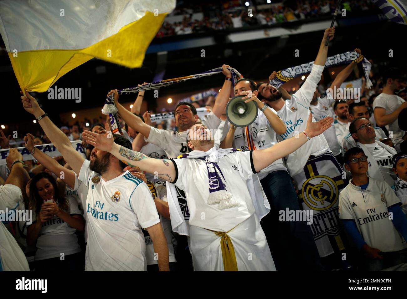Real Madrid supporters watch on big screens placed at the team's ...