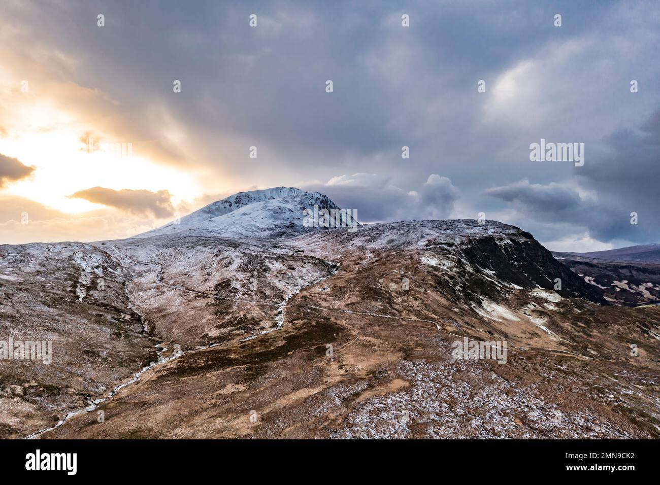Aerial view of the snow covered Mount Errigal, the highest mountain in ...