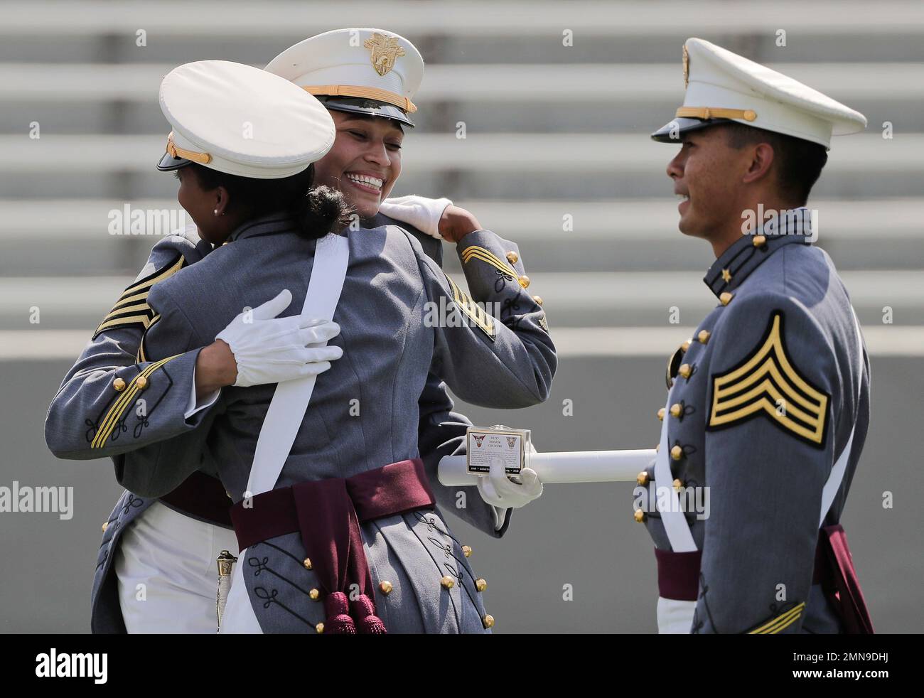 West Point cadets hug after receiving their diplomas during graduation ...