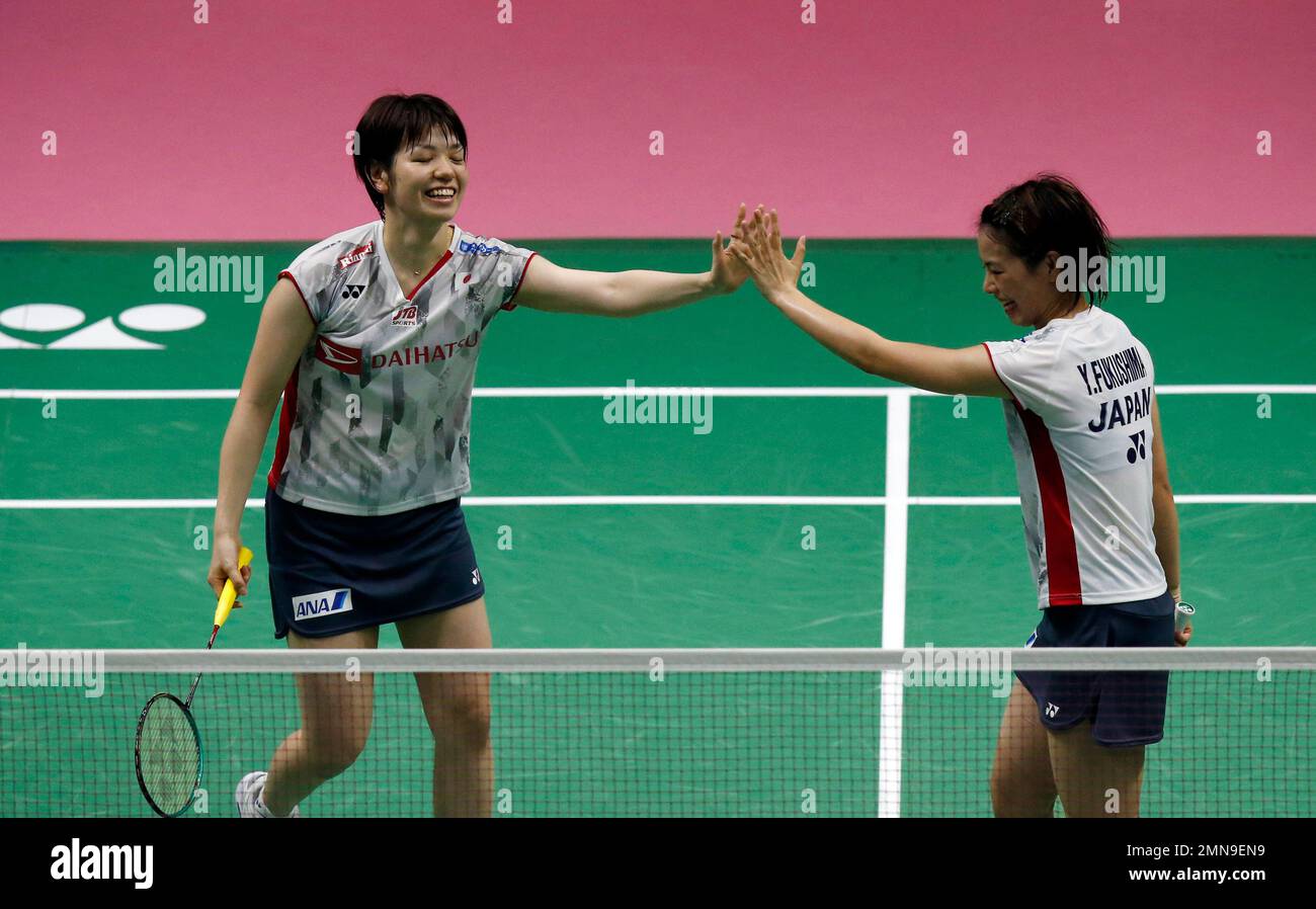 Sayaka Hirota, left, and Yuki Fukushima of Japan celebrate after wining ...