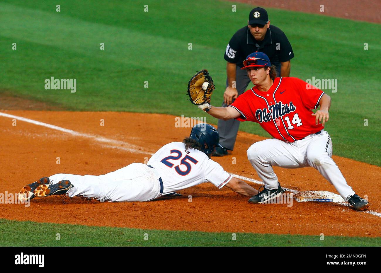 Auburn's Jay Estes (25) beats the tag of Mississippi first baseman Cole ...