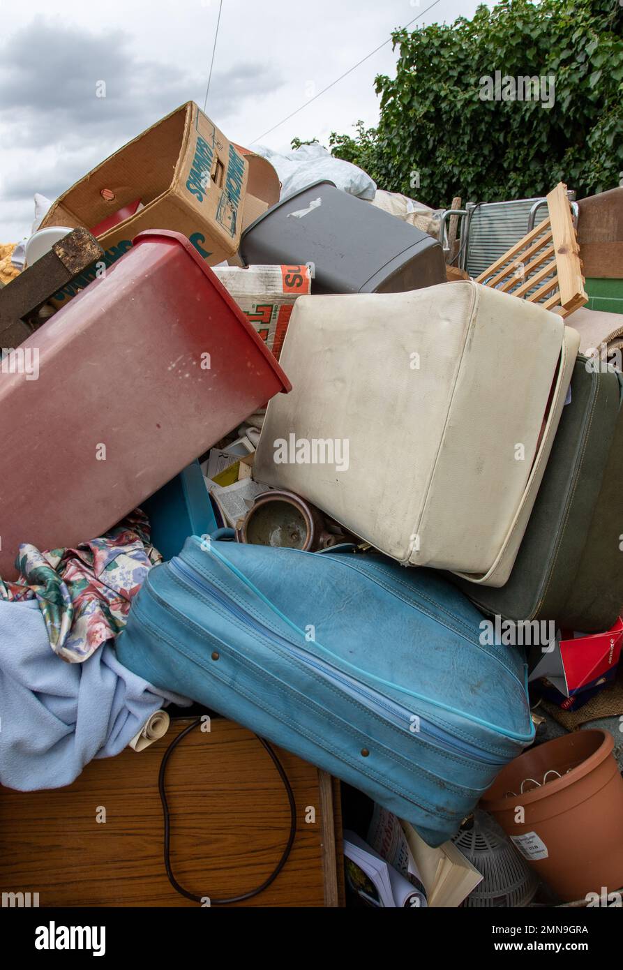 Personal effects from a house clearance casually thrown away in a ...