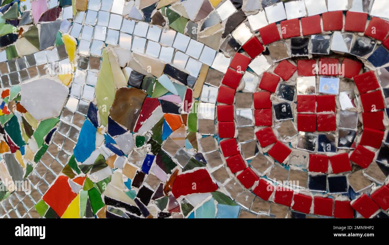 colorful glass mosaic wall tiles and earthenware in pieces background ...