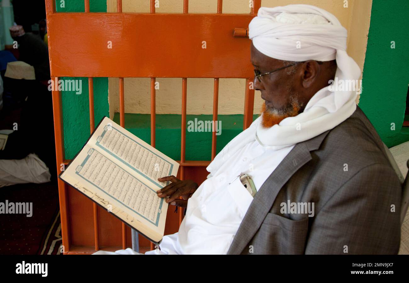 A Kenyan Muslim recites the Holy Quran in Nairobi, Kenya, Friday, May ...