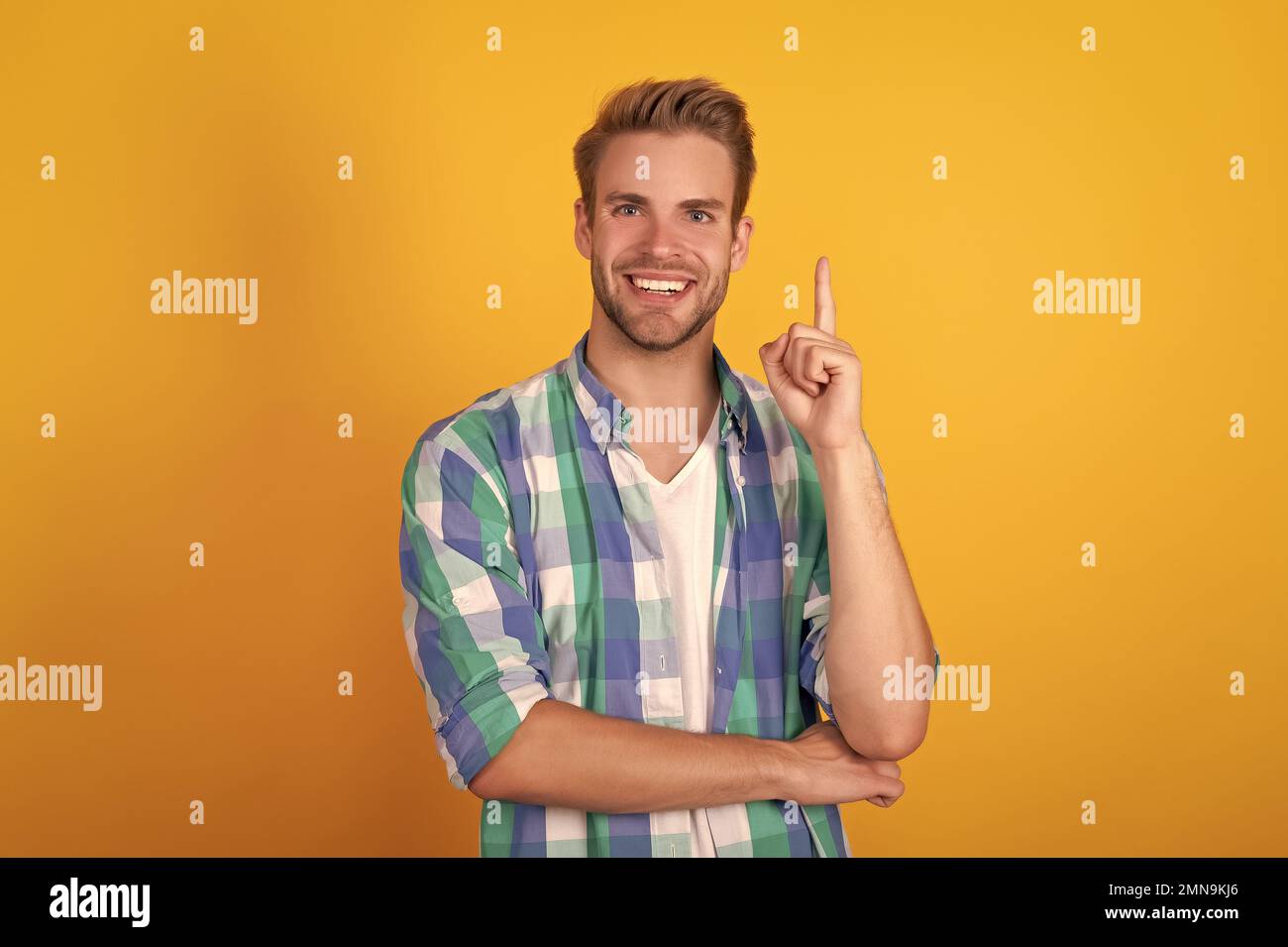 Trust your crazy idea. Happy man keep raised finger. Genius guy make ...