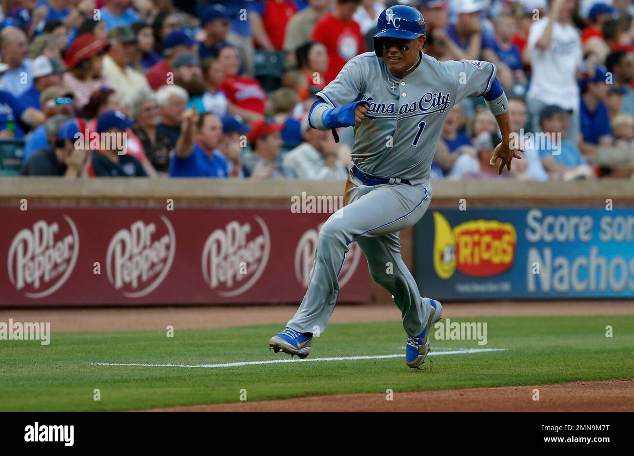 Kansas City Royals Ryan Goins rounds third base on his way to scoring ...