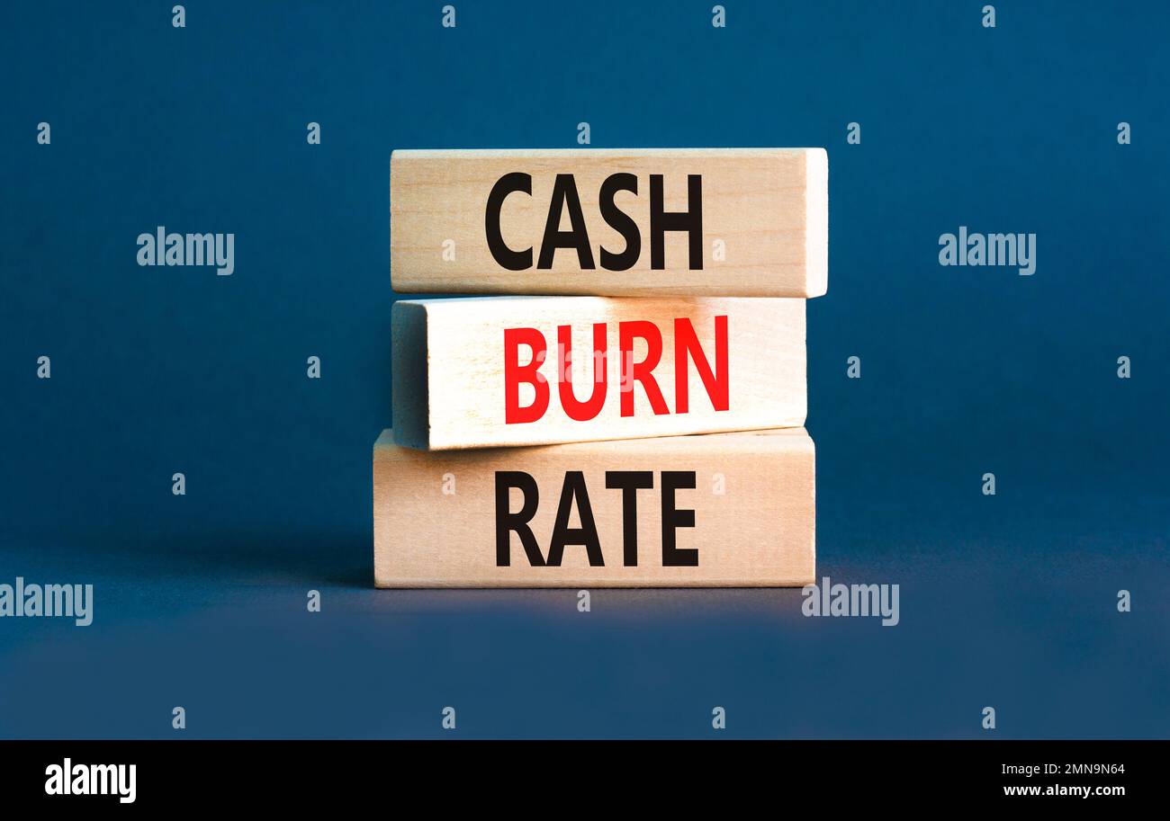 Cash burn rate symbol. Concept words Cash burn rate on wooden blocks on ...