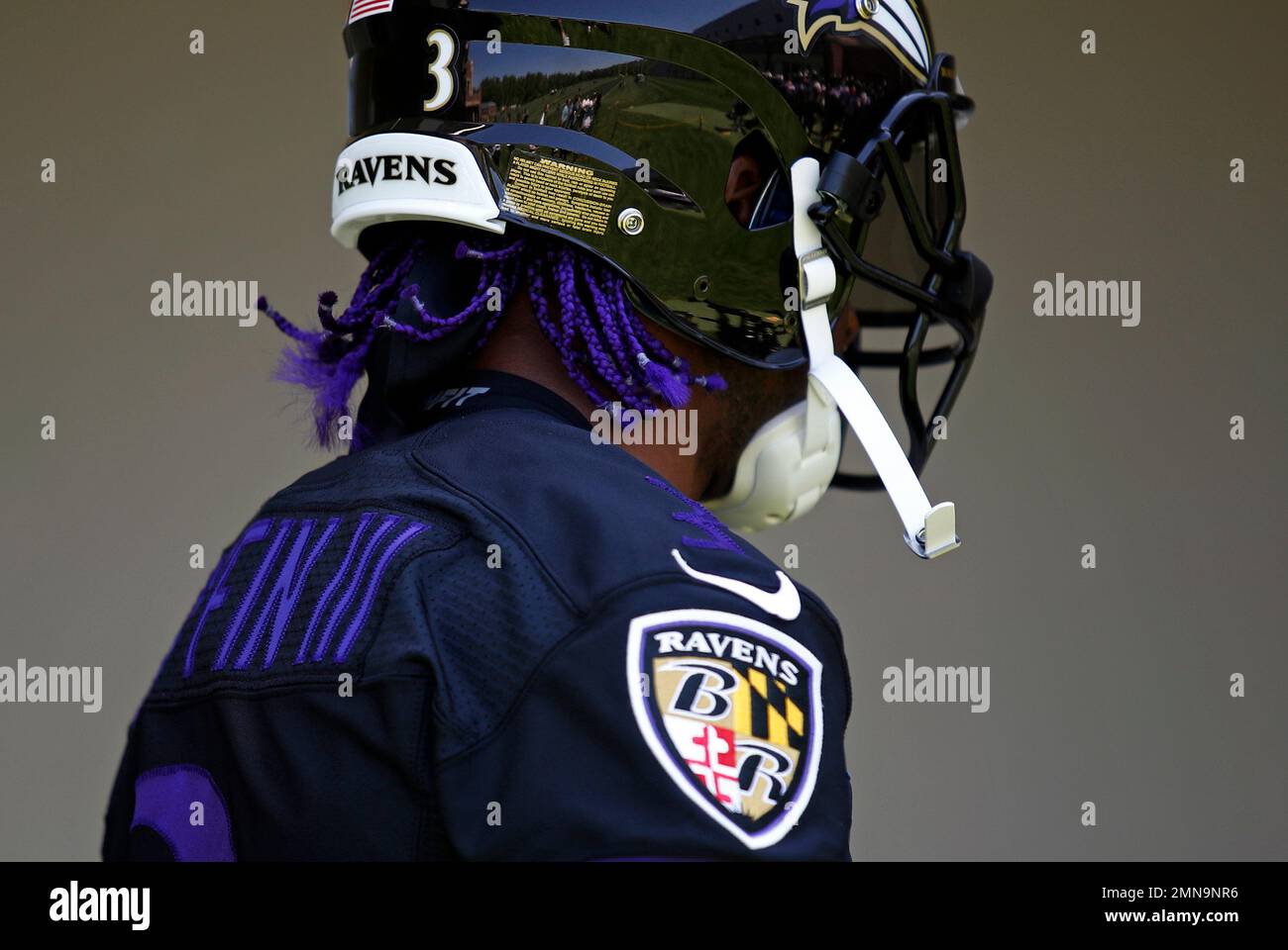 Purple braids poke out from Baltimore Ravens quarterback Robert Griffin ...