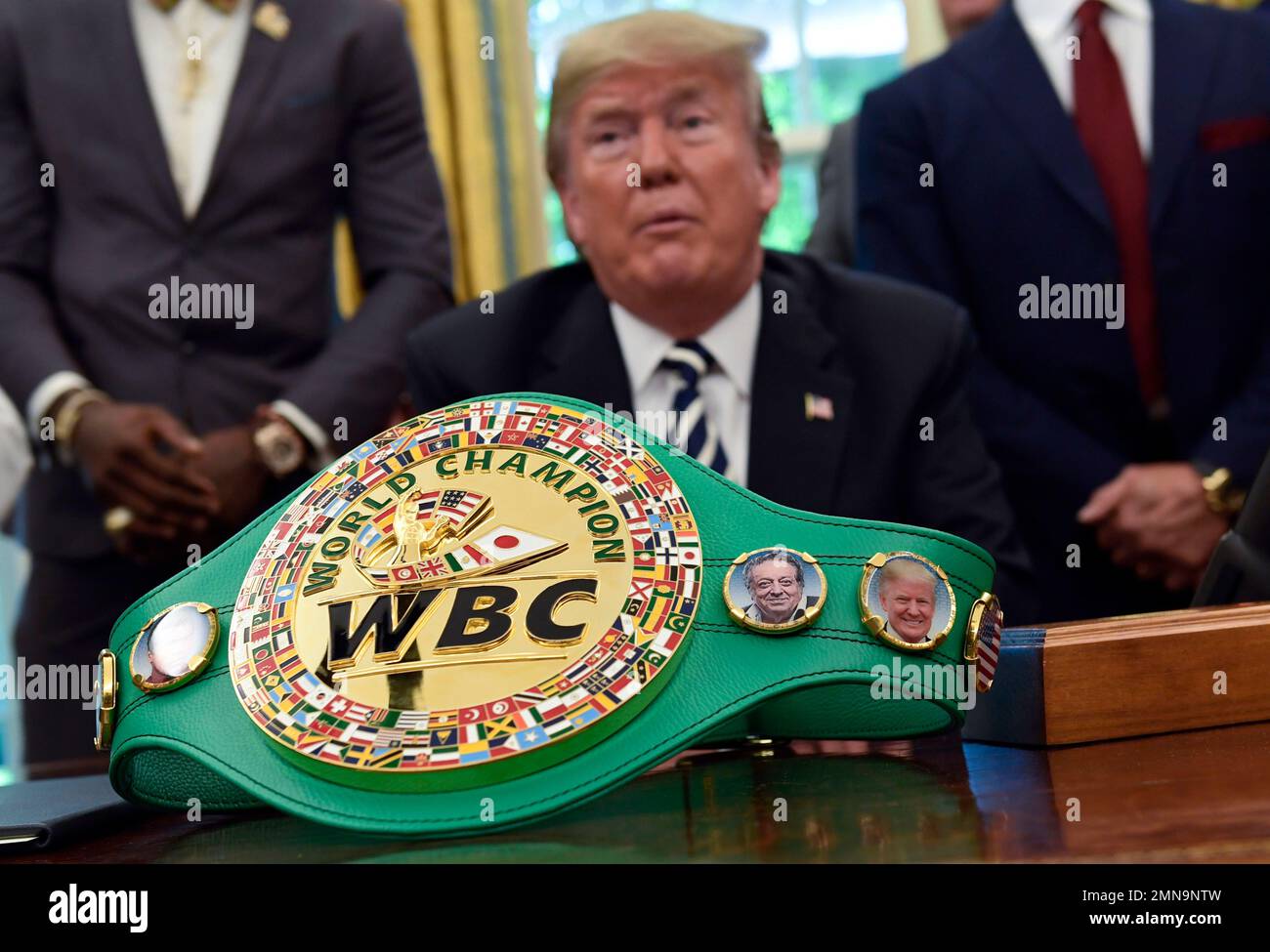 A boxing belt presented to President Donald Trump, sits on the desk in ...