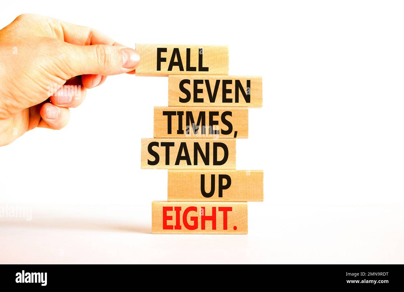 Stand up symbol. Concept words Fall seven times stand up eight on ...