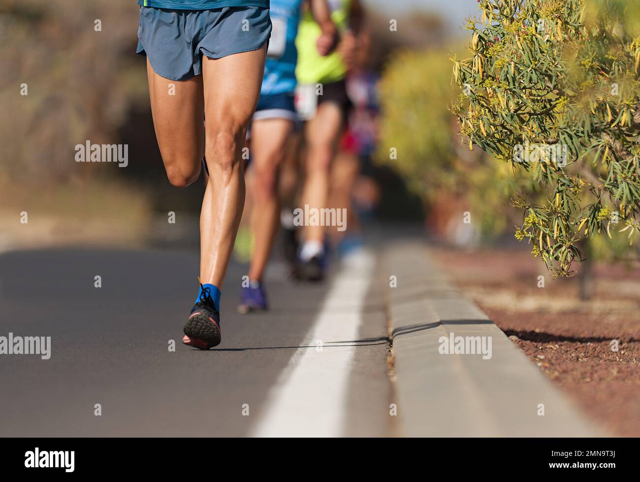 Marathon running race, people feet on city road Stock Photo - Alamy