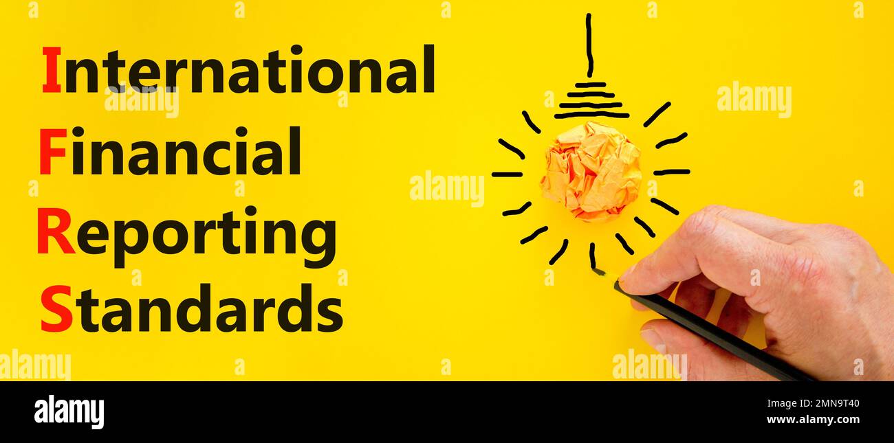 IFRS symbol. Concept words IFRS international financial reporting standards on yellow paper ...