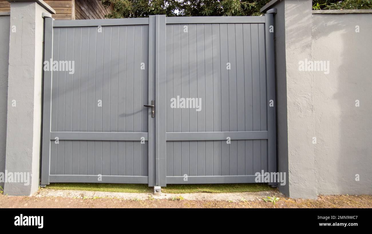grey high home steel door aluminum gate slats Stock Photo - Alamy