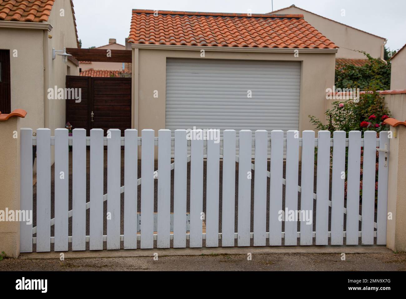 PVC gates of modern house white home door slats Stock Photo - Alamy