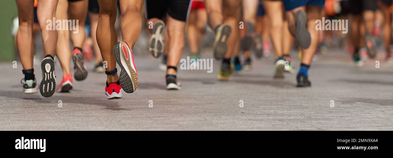 Marathon running race, people feet on city road Stock Photo - Alamy