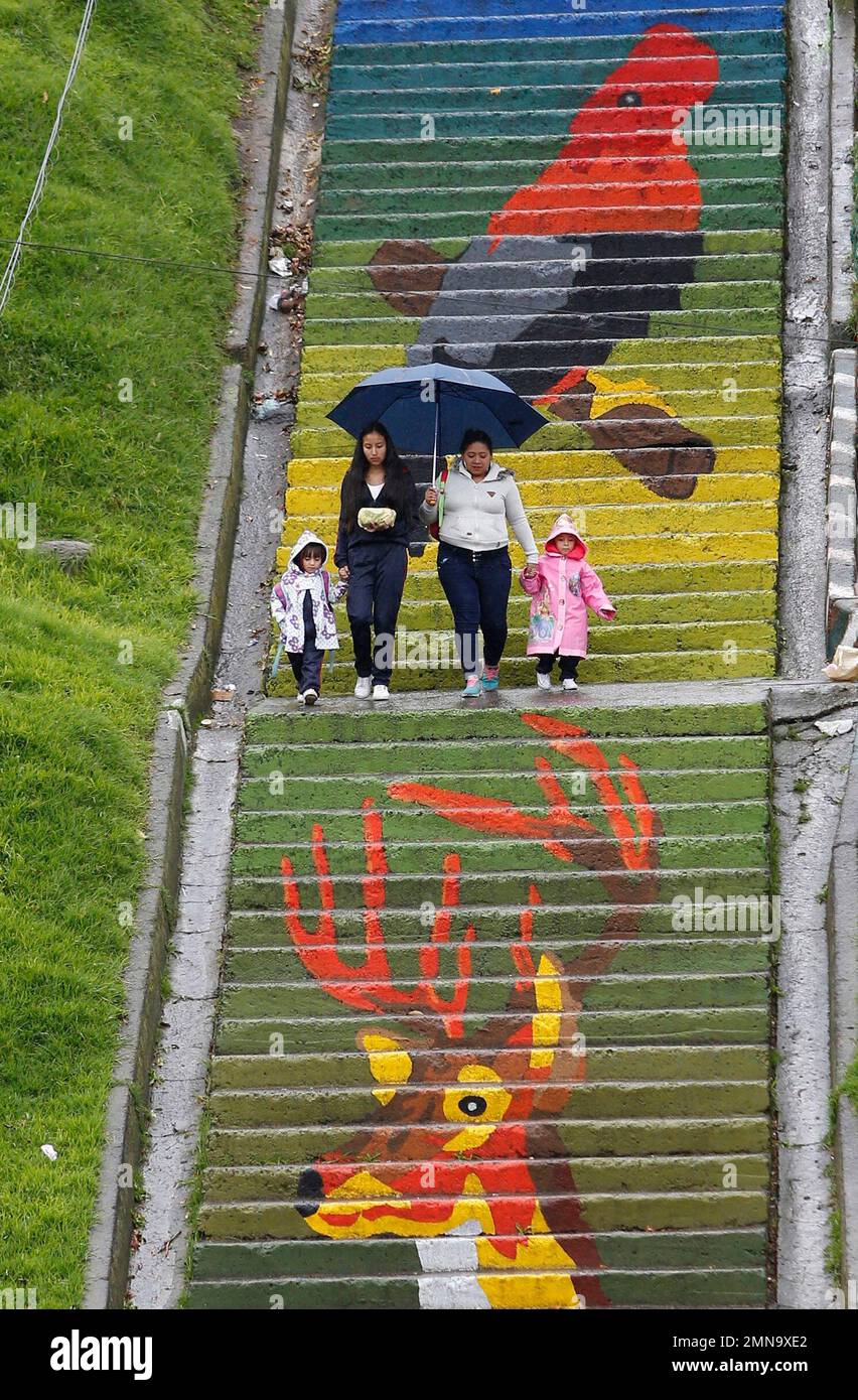 People descend stairs decorated with animals in the Nueva Gloria ...