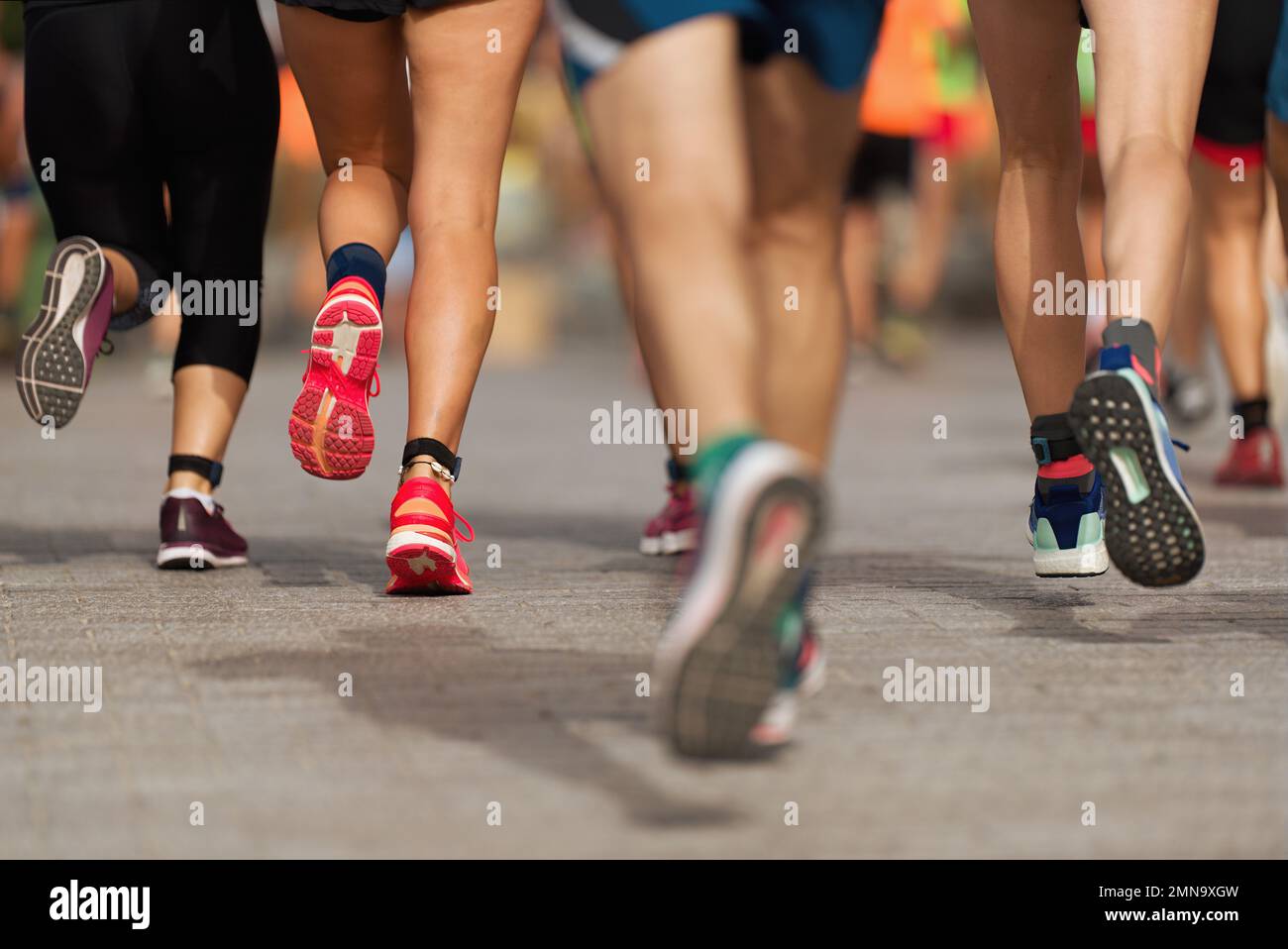 Marathon running race, people feet on city road Stock Photo - Alamy
