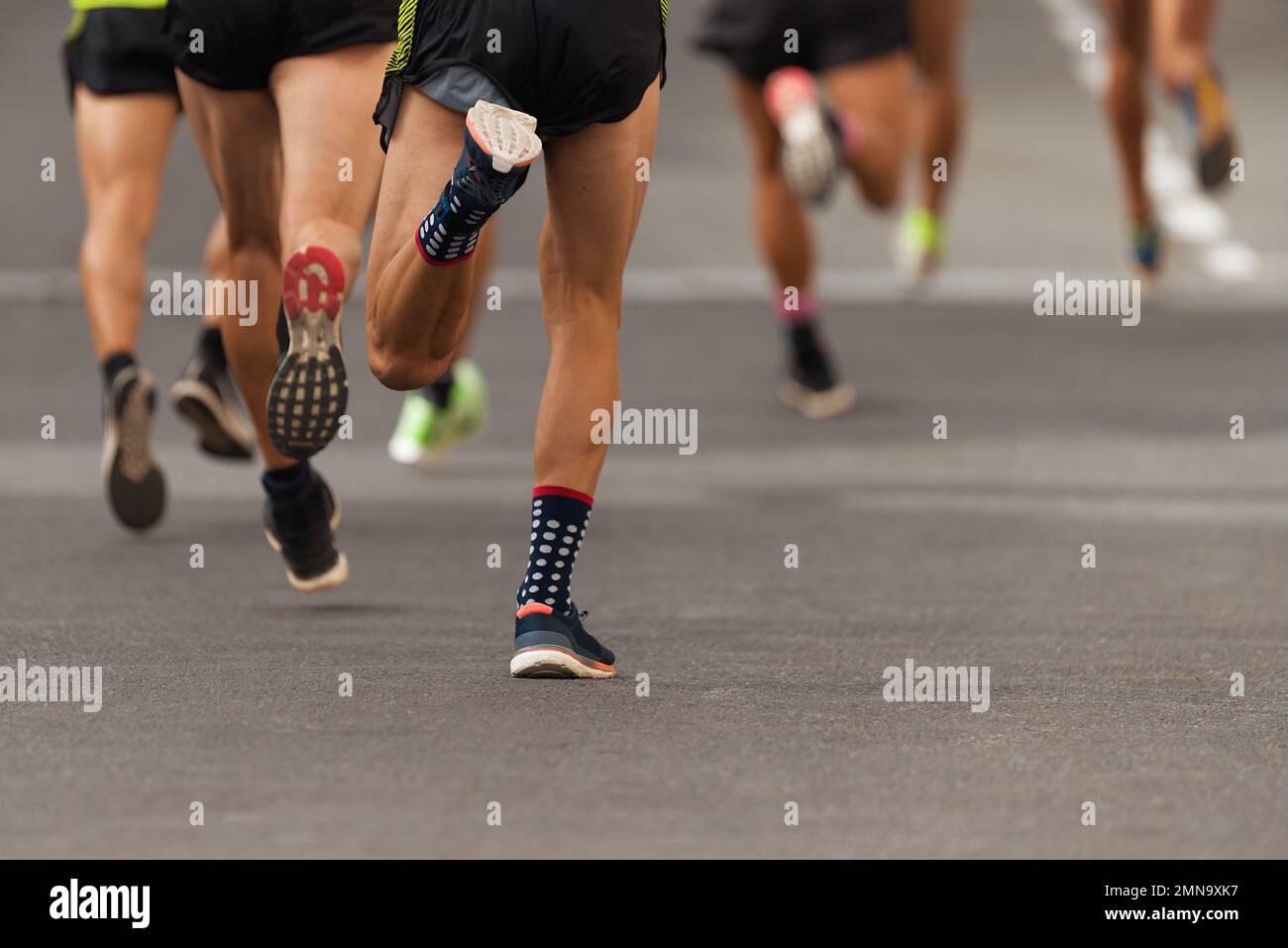 Marathon running race, people feet on city road Stock Photo - Alamy
