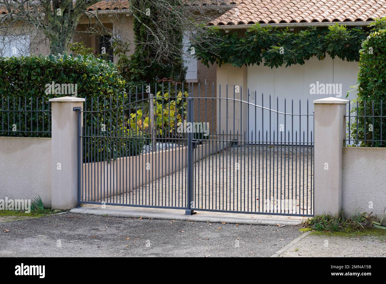 gray gate of classic private portal detached house in suburb street ...