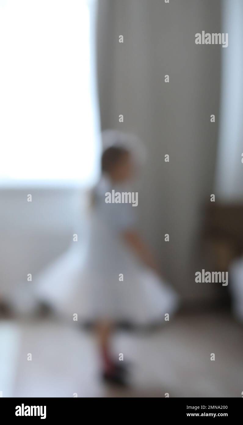 little dancing ballerina girl out of focus indoors. Little Caucasian ...