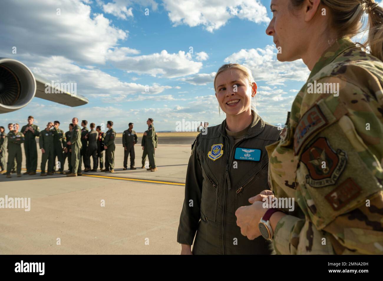 Capt. Ashlen Bible, left, 9th Airlift Squadron aircraft commander, speaks with Staff Sgt ...