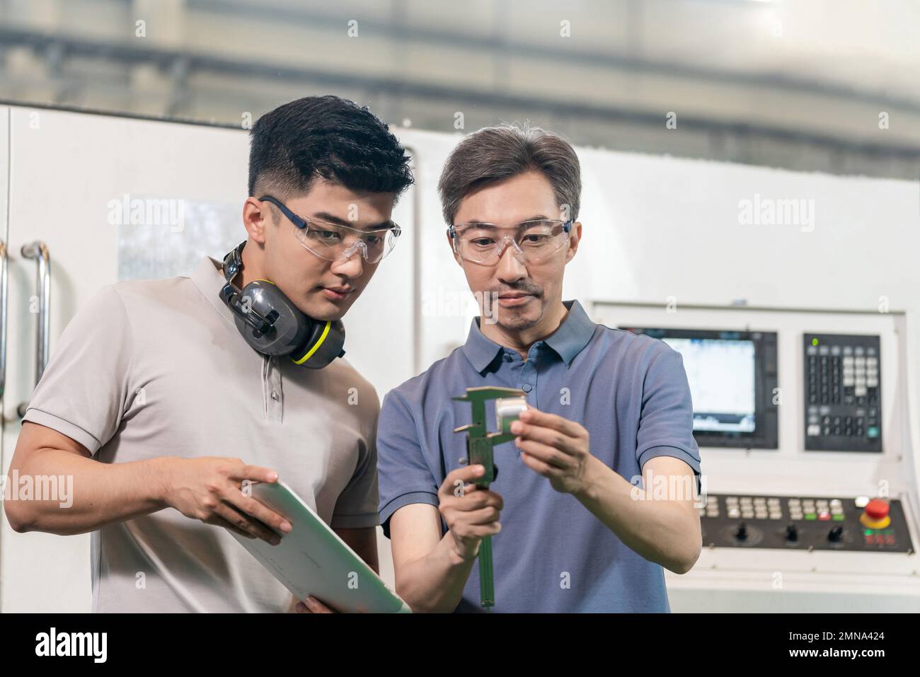 Engineers working in the factory Stock Photo - Alamy