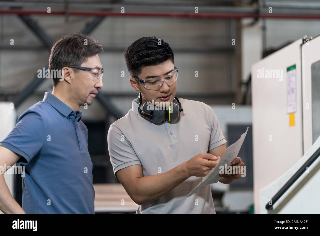 Engineers working in the factory Stock Photo - Alamy