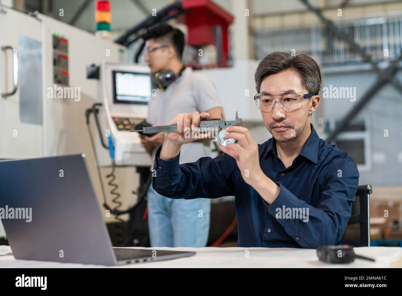 Engineers working in the factory Stock Photo - Alamy