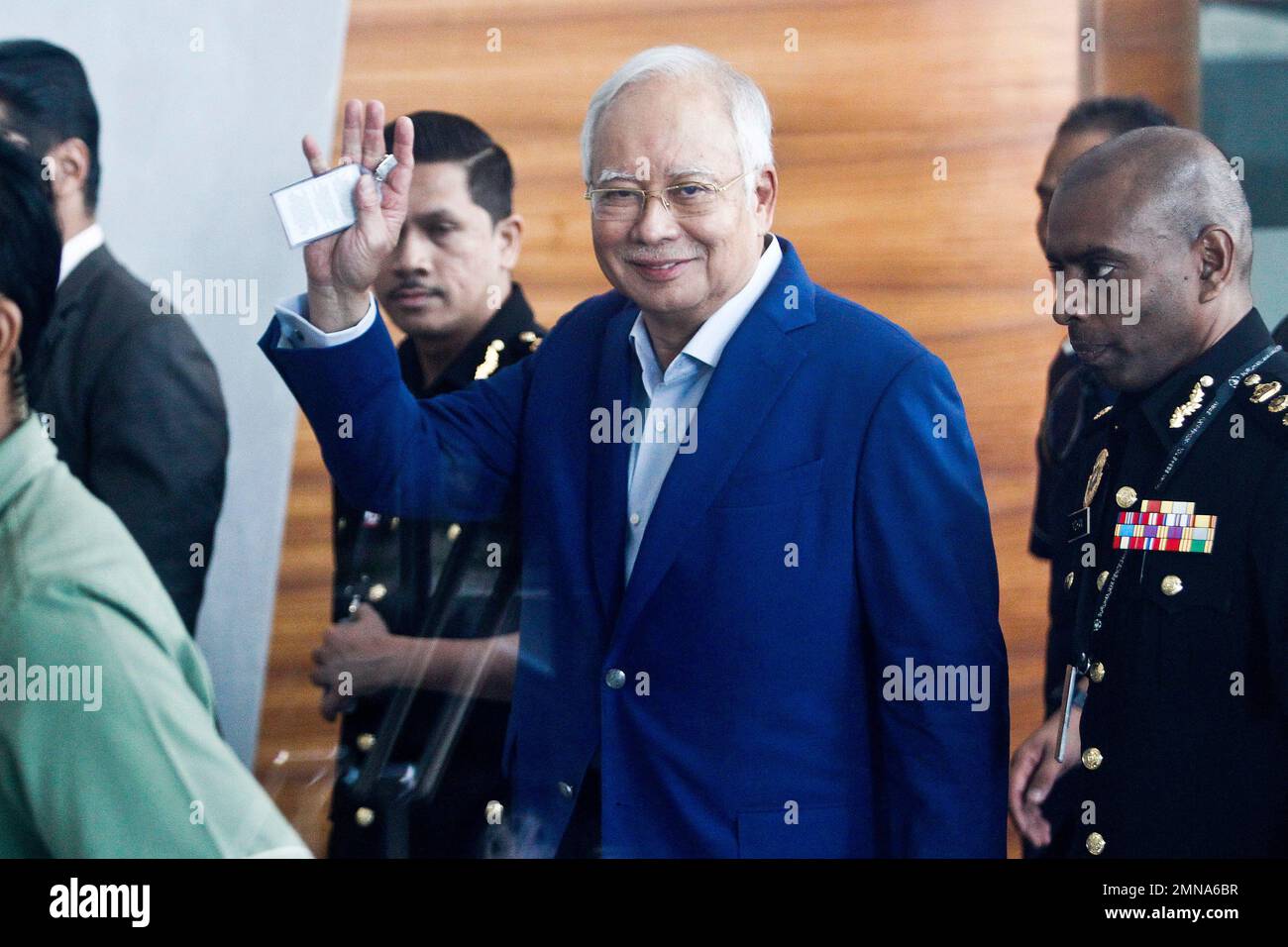 Former Malaysian Prime Minister Najib Razak, center, arrives at ...