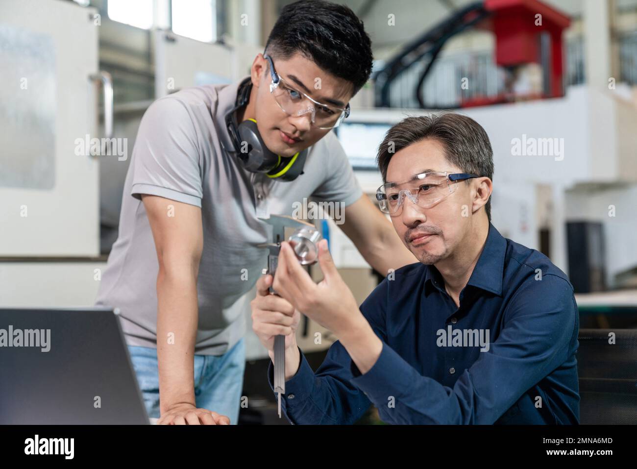 Engineers working in the factory Stock Photo - Alamy