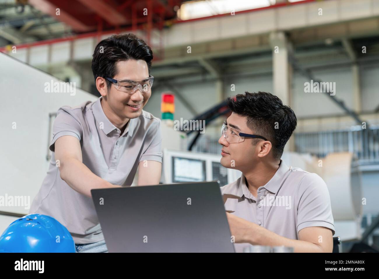 Engineers working in the factory Stock Photo - Alamy