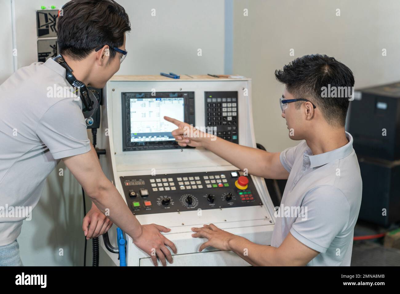Engineers working in the factory Stock Photo - Alamy