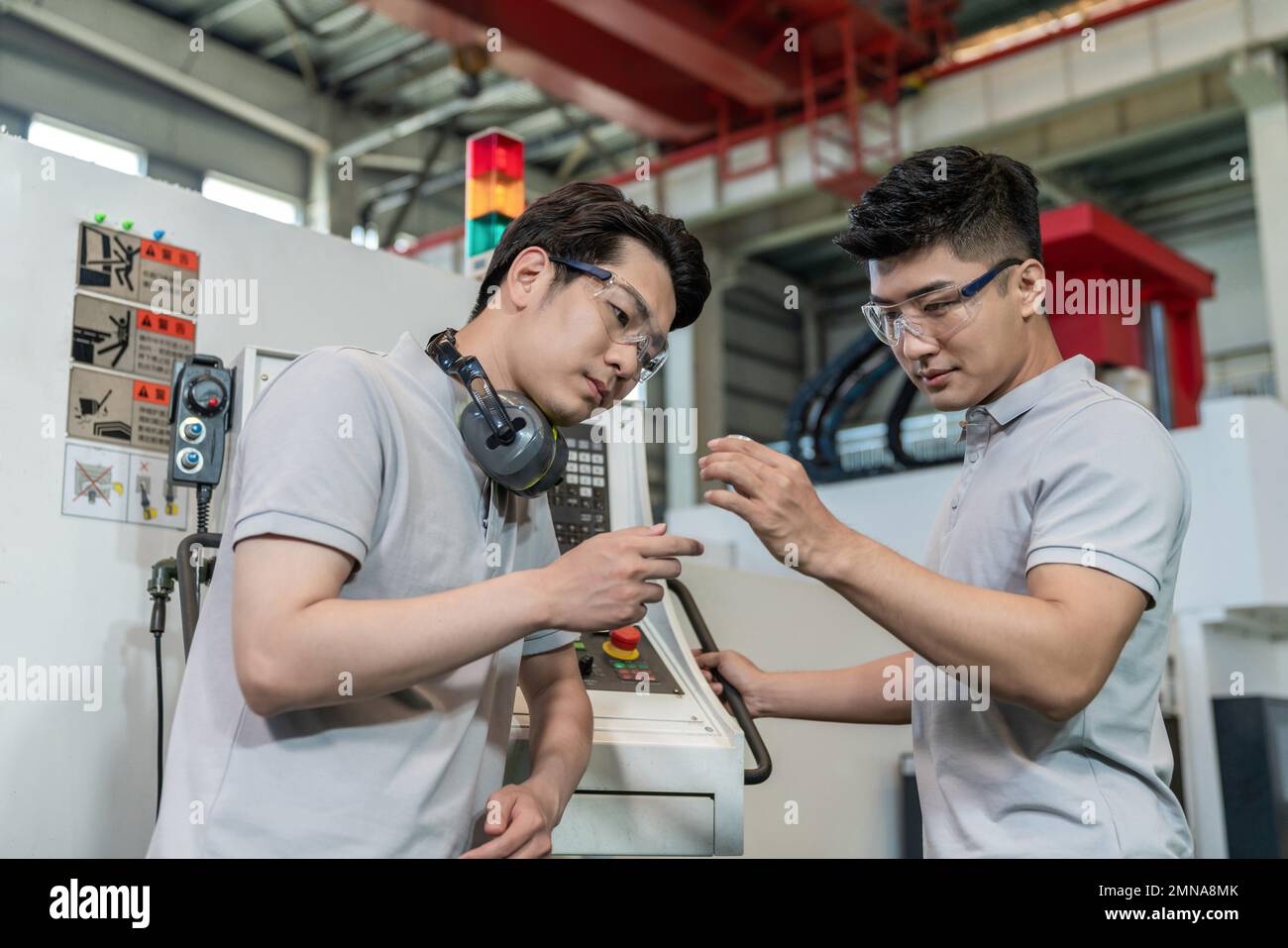 Engineers working in the factory Stock Photo - Alamy