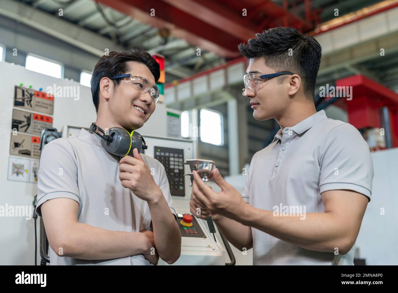 Engineers working in the factory Stock Photo - Alamy
