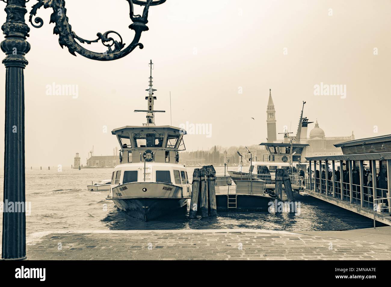 View of San Zaccaria vaporetto ferry boat stop with the people boarding ...