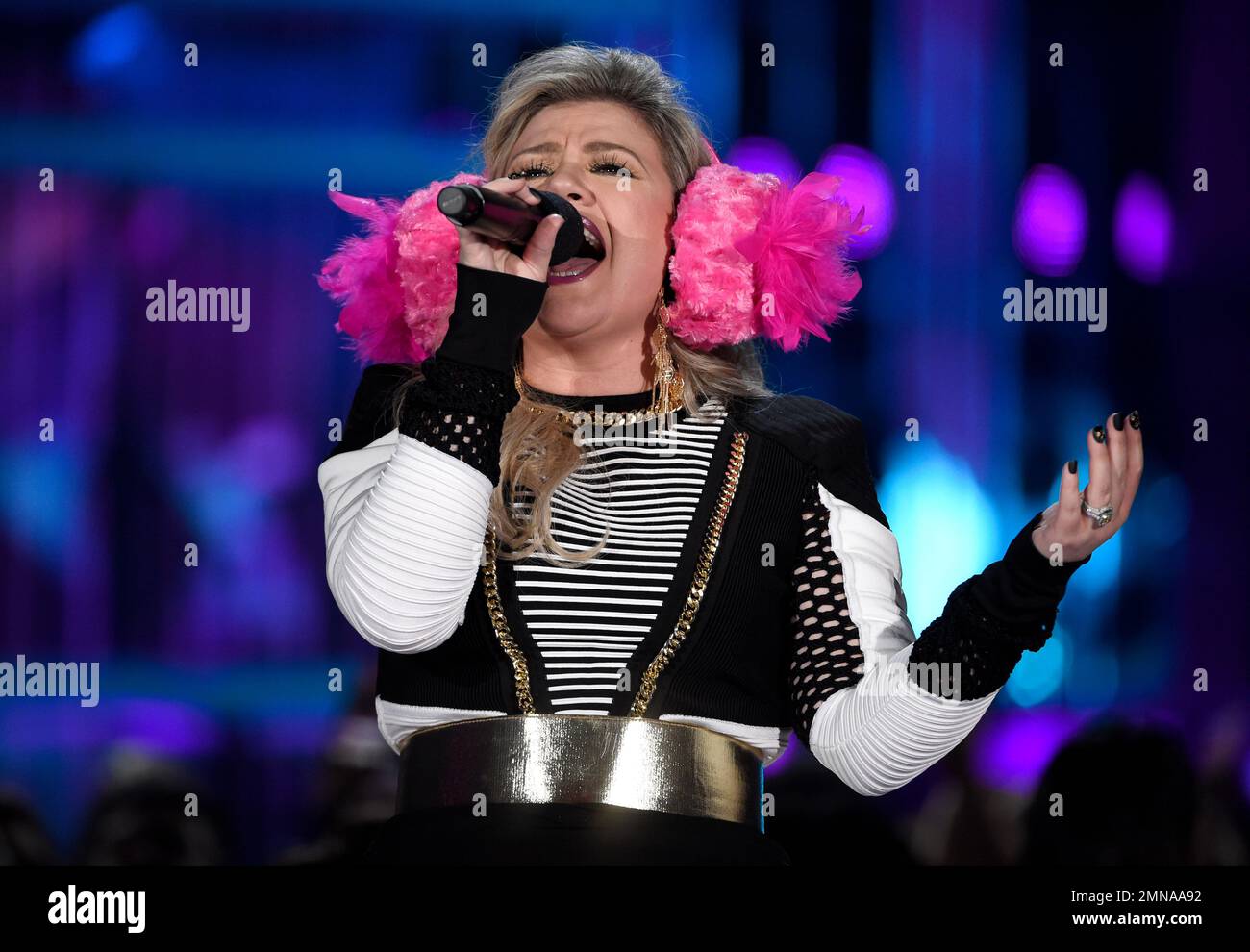 Host Kelly Clarkson introduces a performance by BTS at the Billboard ...