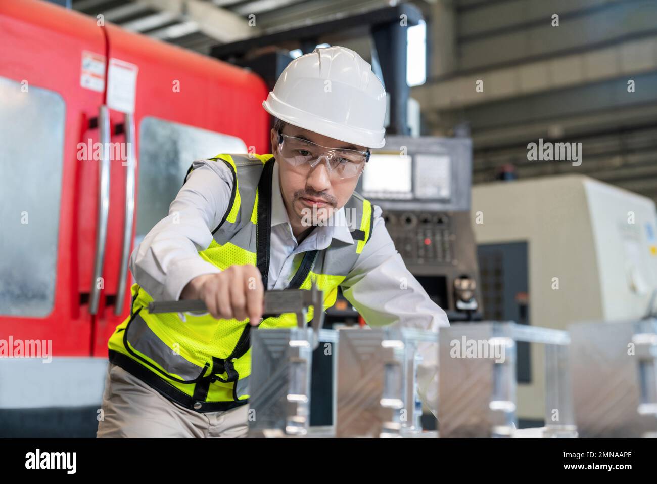 Engineers wear protective overalls wearing helmets working in the ...